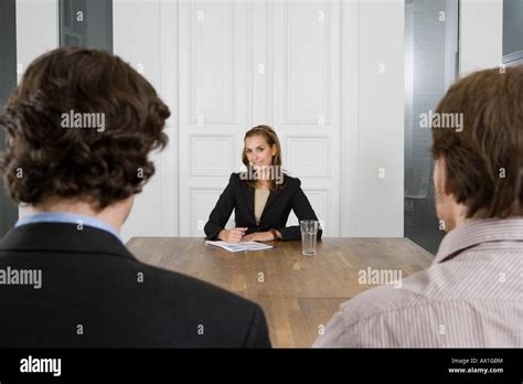 A Woman Meeting With Two Men In A Board Room Stock Photo Alamy