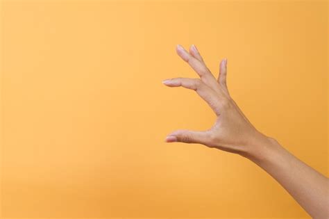 Premium Photo Woman Hand Measuring Invisible Items Or Showing Small