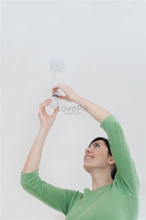 Woman Changing Bulb Picture And HD Photos Free Download On Lovepik
