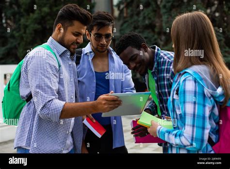 The Group Of Indian Students Help Your Classmate With Navigation Stock