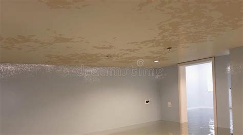 A Basement Submerged In Water Revealing Extensive Flooding And Ceiling