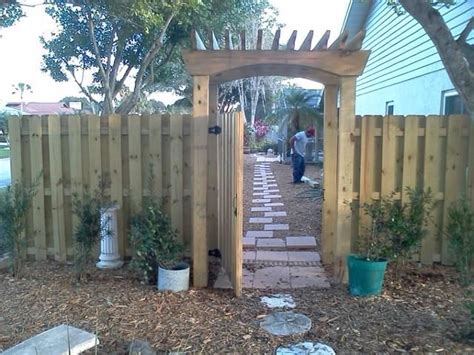 Vertical Shadow Box Fence With A Beautiful Archway Over The Gate Equals A Very Pretty Fence