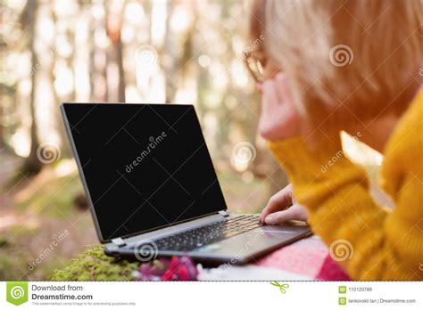 A Mock Up Image Of A Woman S Hand Using And Typing On A Laptop With A Blank Black Desktop On A