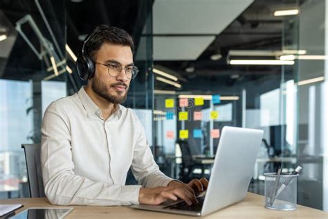 Serious Thinking Programmer Coding New Software Man In Headphones
