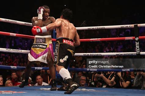 Adrien Broner Backs Into The Corner As Manny Pacquiao Throws A Left