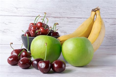 Premium Photo Fruit Set Banana Green Apple And Cherries
