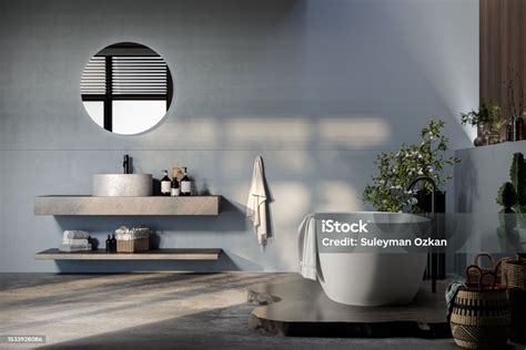 흰색 욕조와 대리석 세면대 바구니 파란색 벽 콘크리트 바닥 식물 나무 벽 패널 자연 채광이 있는 현대적인 욕실 인테리어 현대적인 가구를 갖춘 미니멀한 욕실 3d 렌더링 0