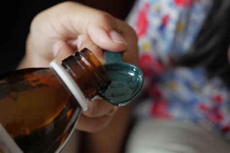 A Dose Of Cough Syrup Premium Photo