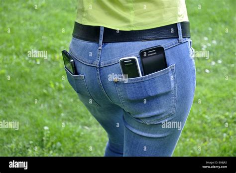 Illustration Model Anna Poses With Cell Phones In Her Back Pockets In