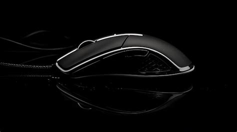 Premium Photo A Sleek Black Gaming Mouse With A Silver Scroll Wheel
