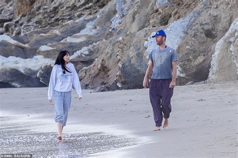 Picture Exclusive Dakota Johnson Wraps Arms Around Boyfriend Chris Martin Daily Mail Online