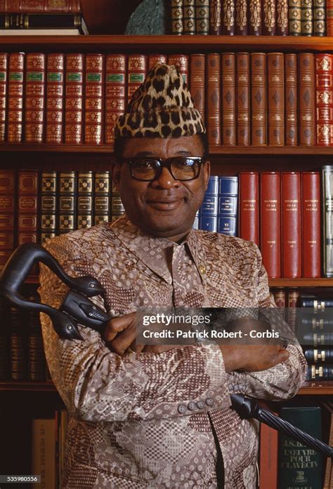 President Mobutu Sese Seko Of Zaire Poses In Front Of The Bookshelves
