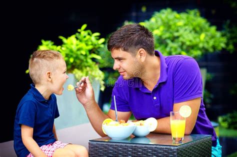 Joyful Father Feeding Son With Tasty Fruit Salad Stock Image Image Of Lifestyle Fork
