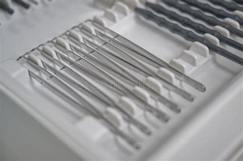 A Close Up View Of A Set Of Surgical Instruments Neatly Arranged In A Tray The Instruments