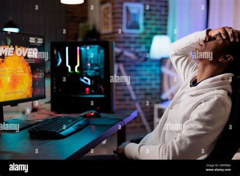 Gamer Upset After Losing Online Multiplayer Action Videogame Match Being Defeated By Foes Man