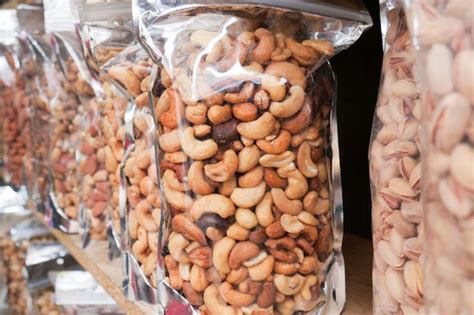 Close Up Of Many Mixed Nuts In A Packet Premium Photo
