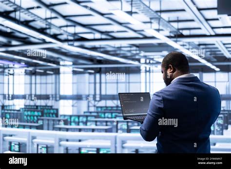 admin in data center identifying and solving technical malfunctions