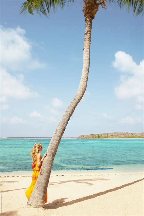 Beautiful Woman Relaxing On The Beach By Stocksy Contributor