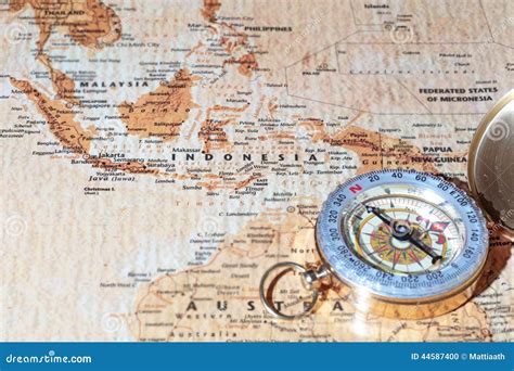 Travel Destination Indonesia Ancient Map With Vintage Compass Stock