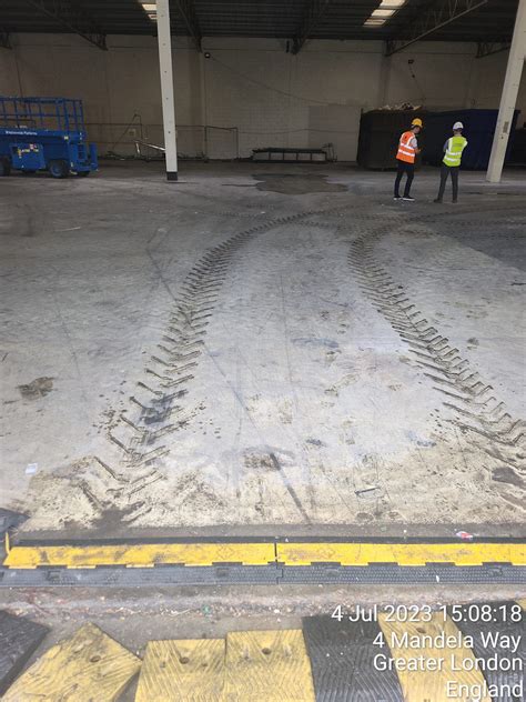 Warehouse Floor Surveying Being Undertaken During The Dilapidation