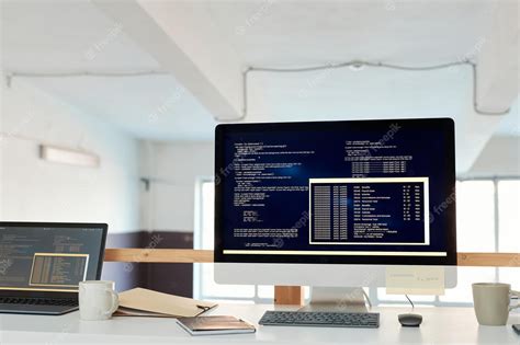 premium photo computer with programming code on screen on office desk of software developer