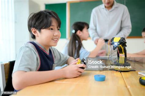 Stem Class Teacher And Students In Basic Engineering Classroom Stock