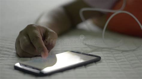 Woman S Hand Scrolling On Digital Tablet Screen For Surfing Social Media On The Bed At Night