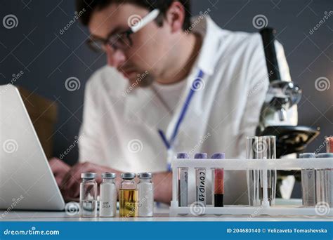 Microscope With Computer Monitor On Desk Royalty Free Stock Image