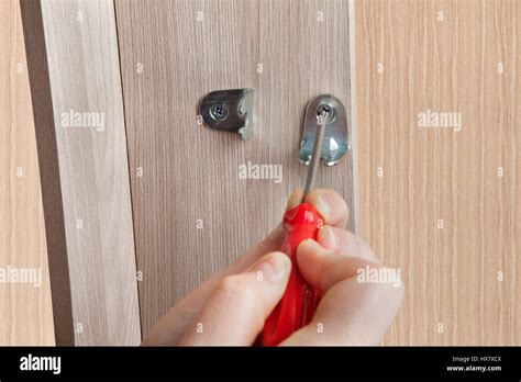 Mounting Furniture Bracket Screw Using Phillips Head Screwdriver Stock