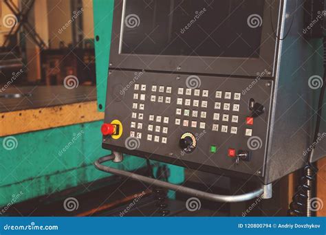 The Worker Uses The Control Panel Of The CNC Machine To Process The Material Stock Photo
