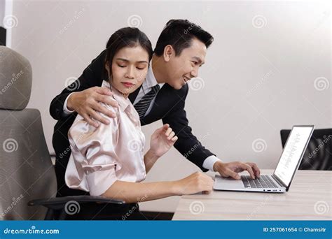 Businessman Grab His Secretary Shoulder While Looking At The Laptop In