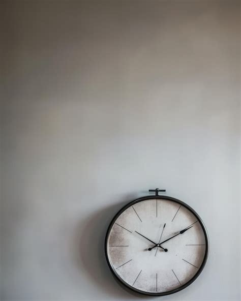 Minimalist Wall Clock On A Plain Gray Background Premium AI Generated Image