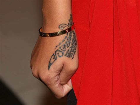 A Guide To Rihannas Tattoos And What They Mean