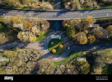 Aerial View Of A Small Traffic Roundabout On A Rural Road With Fall