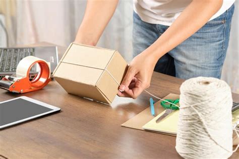 Premium Photo Midsection Of Businessman Packing On Table