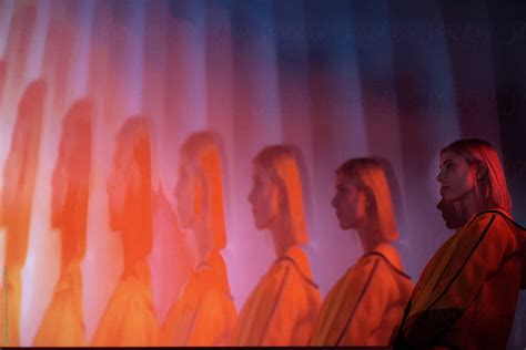 contemporary blond model in neon recursion by stocksy contributor