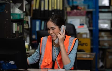 Premium Photo Female Warehouse Worker Counting Small Parts Stored In The Blue Storage