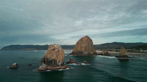 Wide Aerial Shot Of Haystack Rock Beach In Coastal Town Cannon Beach Oregon Wide Shot Footage