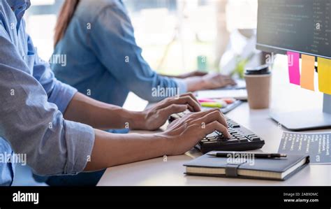 Pensive Programmer Working On On Desktop Pc Programming Code