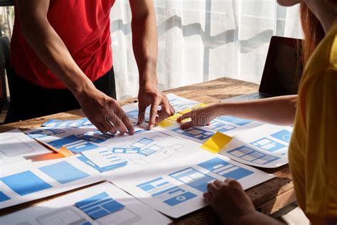 group of ux developer and ui designer brainstorming about app interface