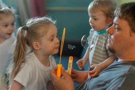Premium Photo Boy Blowing Bubbles