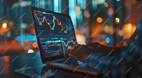 Premium Photo A Man Working On A Laptop With A Graph Showing The Graph Of Graph