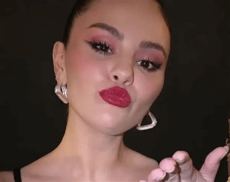 While On A Paris Trip Selena Gomez Almost Slipped Out Of Her Plunging Button Down Shirt