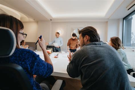 Collaborative Coworkers Engaging In A Productive Team Meeting At Modern Office Stock Image