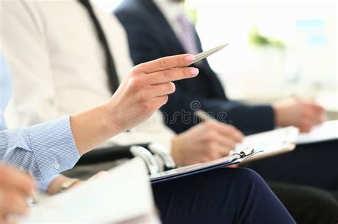 Number Of Business Delegates Listen To Lecture And Take Notes Sitting