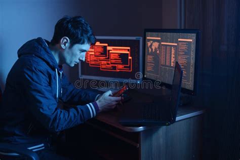 Male Hacker Uses The Mobile Phone To Hack The System Concept Of Cyber