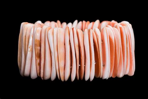 An Philippines Elasticated Bracelet Of Seventy Pink And Cream Narrow