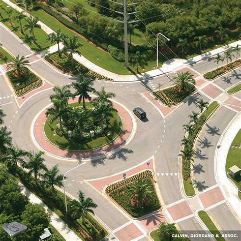 Roundabout In Urban Landscape Aerial View Of Roundabout With Palm