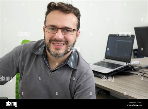 Happy Young Business Man Software Developer Computer Technician Working In Modern Office Of A