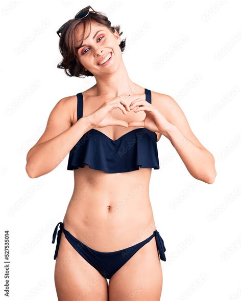 Beautiful Young Woman With Short Hair Wearing Bikini Smiling In Love Showing Heart Symbol And